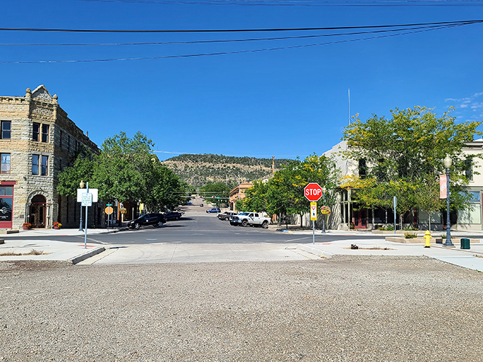 Downtown streets meet at perfect right angles, a testament to frontier planning where stone buildings anchor corners like punctuation marks in history.