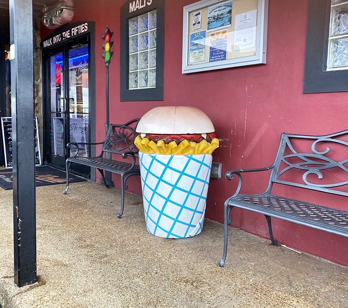 That burger-shaped trash can isn't just cute—it's truth in advertising. "Feed me your garbage, but save room for the real burgers inside."