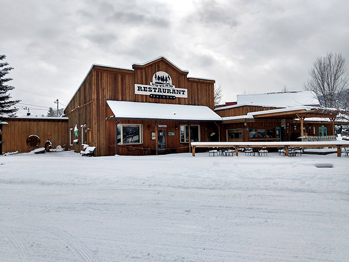 Winter blankets Joseph in pristine snow, transforming local restaurants like this rustic log cabin eatery into cozy retreats where comfort food tastes even better.