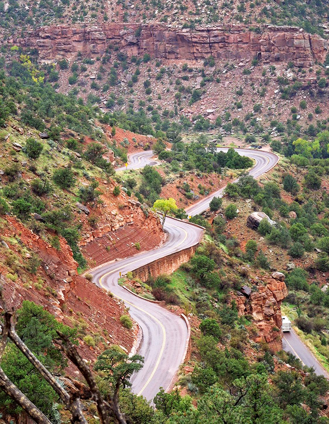 The switchbacks from above reveal the road's artistic dance with the landscape. Engineers and nature collaborated on this masterpiece.