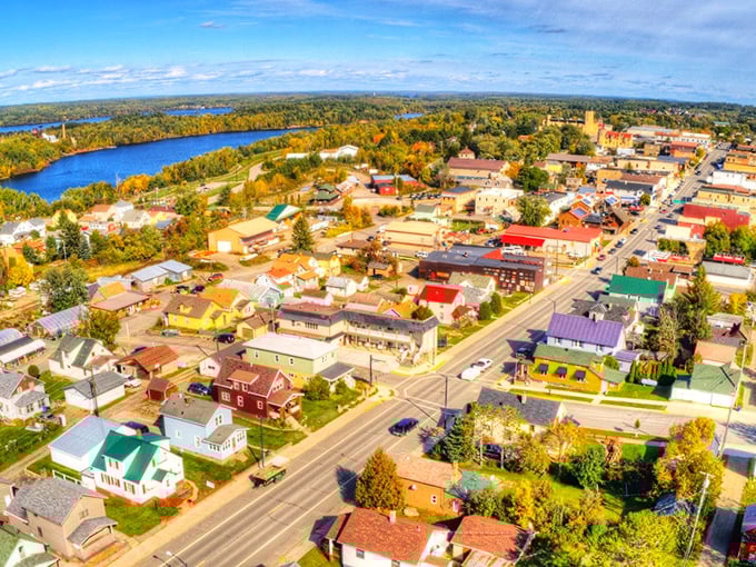 From above, Ely reveals its perfect positioning between civilization and wilderness. The town nestles between colorful autumn forests and the blue waters that made it famous.
