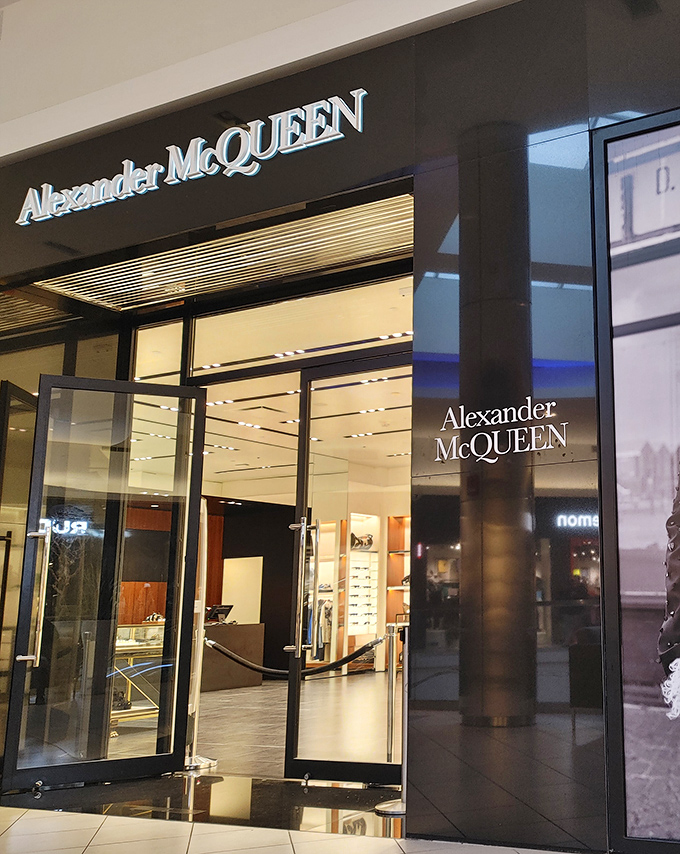 Alexander McQueen's sleek entrance beckons fashion risk-takers—where avant-garde meets "I found it at the outlets" bragging rights.