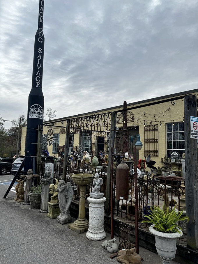 The outdoor garden gallery proves that architectural salvage doesn't fear the elements &ndash; these stone sentinels stand ready for their next post.