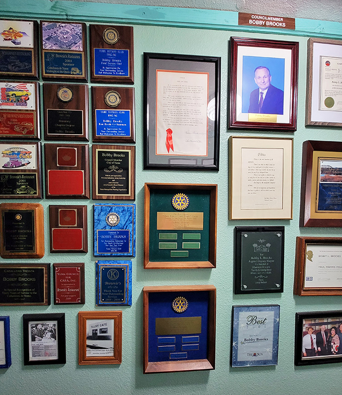 A wall of plaques and community awards tells you everything about how deeply Brownie's is woven into Yuma's social fabric.