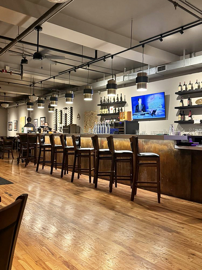 A bar that invites you to linger, where Italian wines stand at attention and conversations flow as smoothly as the house Chianti.