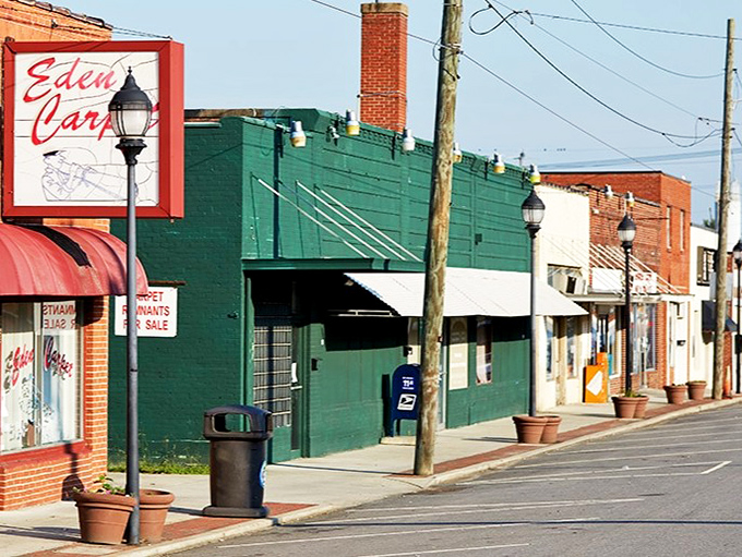 The Eden Car sign stands as a cheerful landmark along a row of storefronts. In small towns, even the signage feels like an old friend.