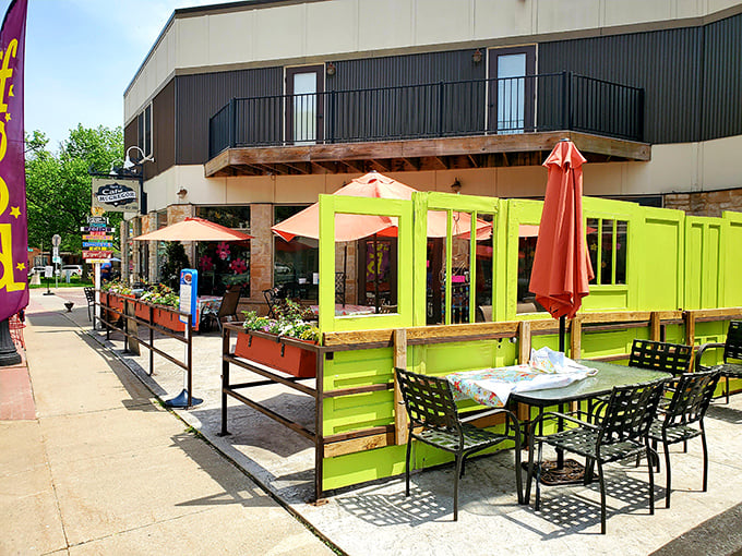 Cafe McGregor's vibrant outdoor seating area brings a pop of lime-green energy to the historic streetscape. Al fresco dining at its most cheerful!