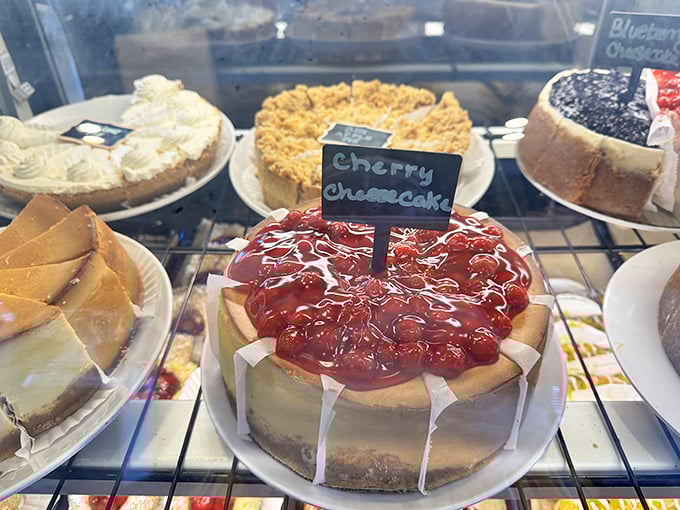 The dessert case showcases beautiful cakes that make choosing just one an impossible but delightful dilemma.