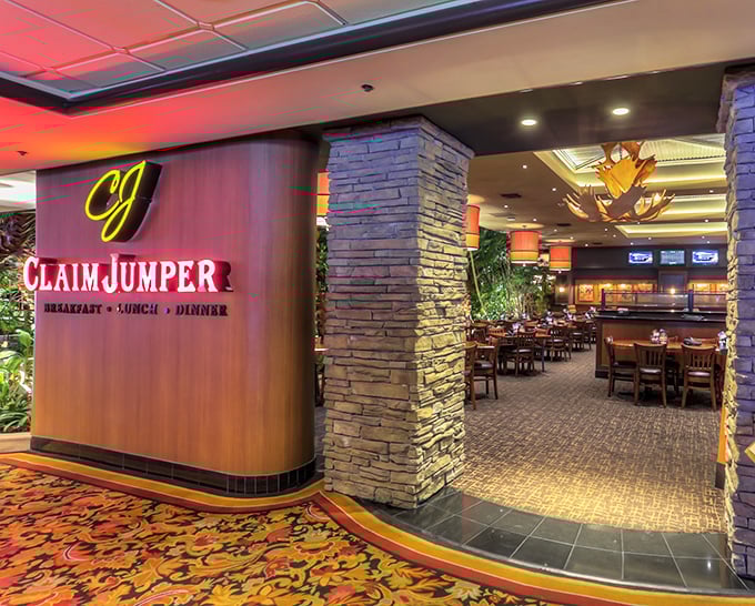 Claim Jumper Restaurant welcomes hungry visitors with warm lighting and southwestern stone, promising hearty meals after a day of desert adventures.