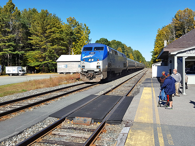 The Amtrak Vermonter arrives at Claremont Station, connecting this charming New Hampshire town to the wider world while passengers capture the moment.