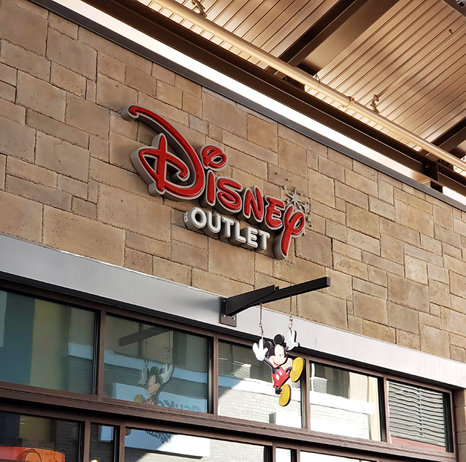 The Disney Outlet, where parents' budgets go to battle children's dreams, and Mickey stands guard over treasures at magical prices.