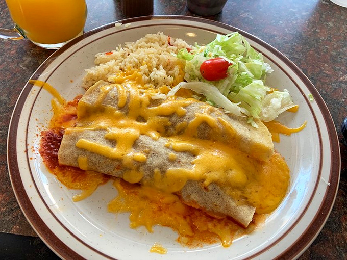 Enchiladas smothered in cheese and chile sauce with a side of rice&mdash;the plate that launched a thousand "I'll just have a salad tomorrow" promises.