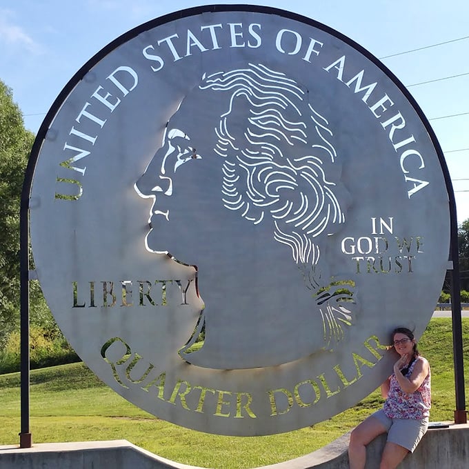 Taking a seat at the base of greatness, visitors find the perfect resting spot to contemplate both history and highway adventures.