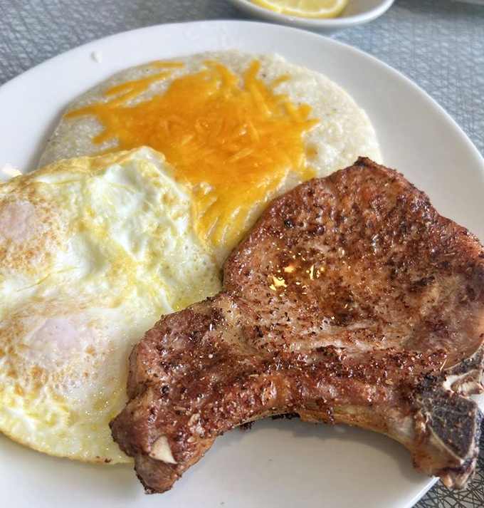 A perfectly seared pork chop with eggs sunny-side up&mdash;the breakfast of champions who plan to skip lunch.