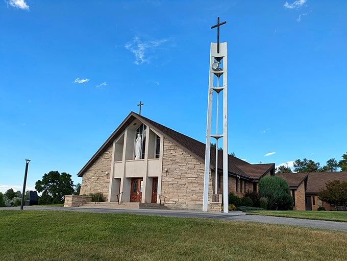 Holy Rosary Catholic Church's modern bell tower reaches skyward, a spiritual landmark against Wyoming's endless blue horizon.