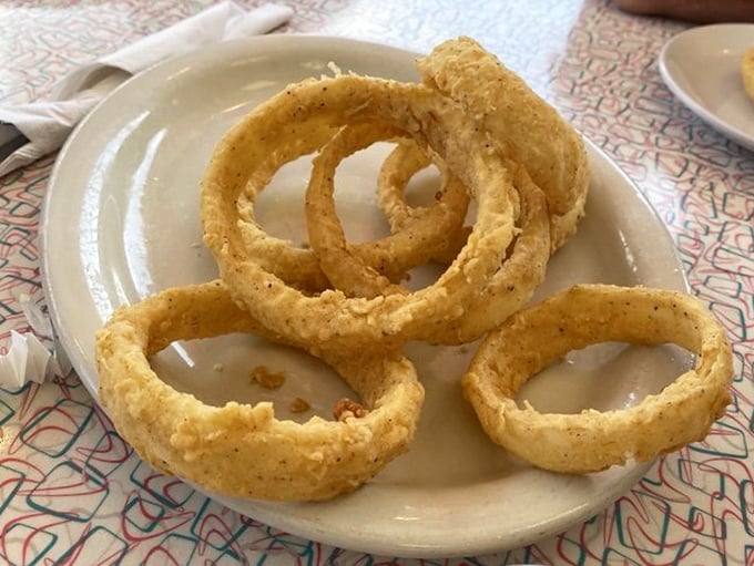 Homemade onion rings with that perfect crunch—golden halos of flavor that make you wonder why anyone would ever settle for frozen.