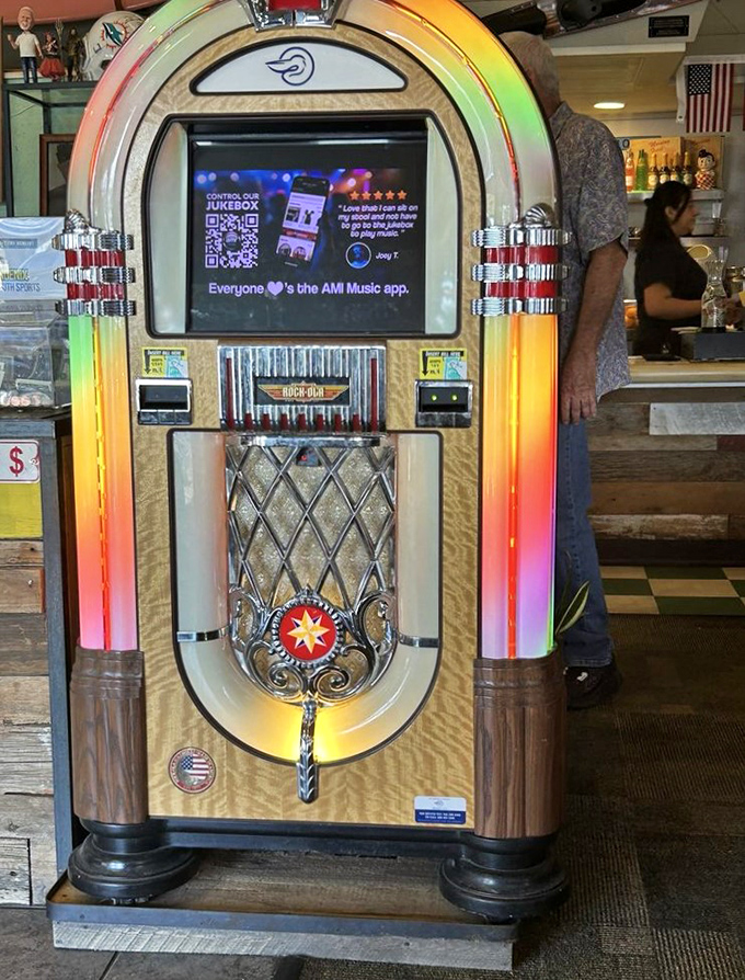 This isn't just any jukebox&mdash;it's a time machine offering musical accompaniment to your pancake journey, glowing with nostalgic promise.