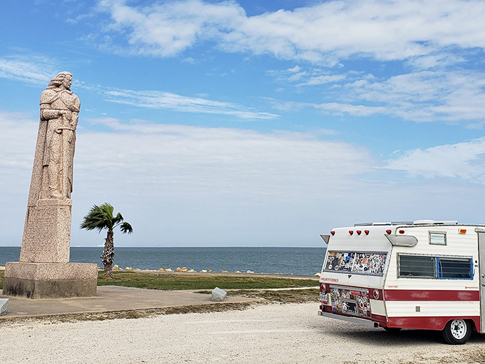 La Salle's monument stands sentinel over the bay, while a vintage camper reminds us that exploration never goes out of style&mdash;it just gets more comfortable.