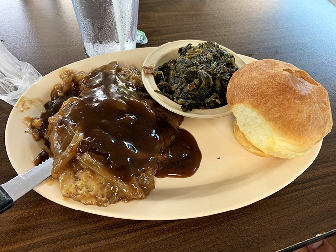 Liver and onions with turnip greens&mdash;a plate that separates the tourists from the true Southern food enthusiasts.