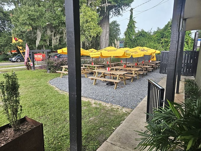 The outdoor seating area&mdash;where yellow umbrellas stand guard over picnic tables, promising al fresco feasts under Carolina skies.