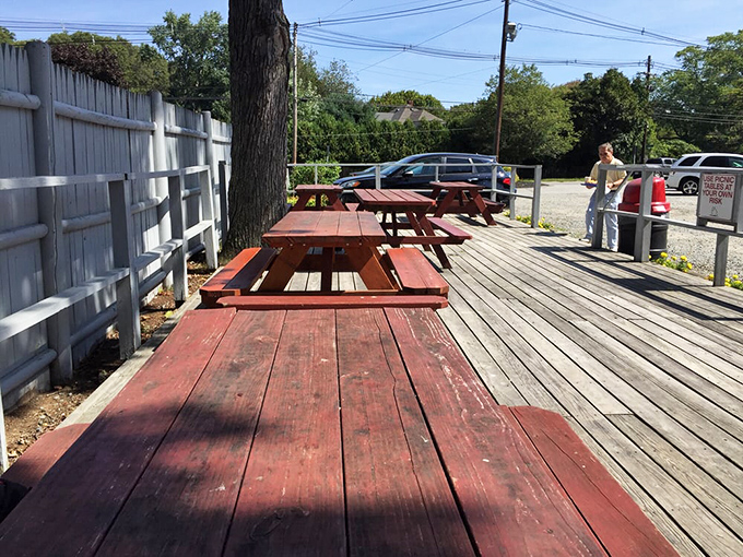 Outdoor picnic tables where memories are made, napkins are desperately needed, and seagulls eye your lunch with unabashed optimism.