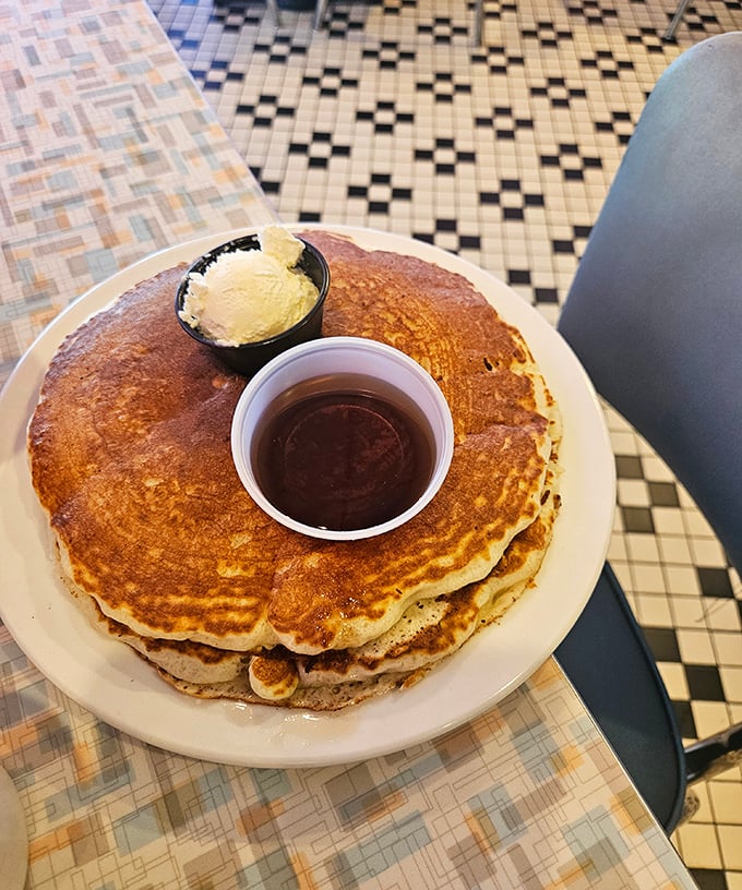 These pancakes don't just arrive at your table &ndash; they make an entrance, golden-brown and ready for their close-up before meeting their delicious maple destiny.