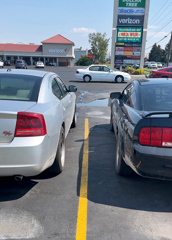 The parking lot view reveals this Dollar Tree's strategic location in a bustling shopping center—convenience that makes saving even easier.