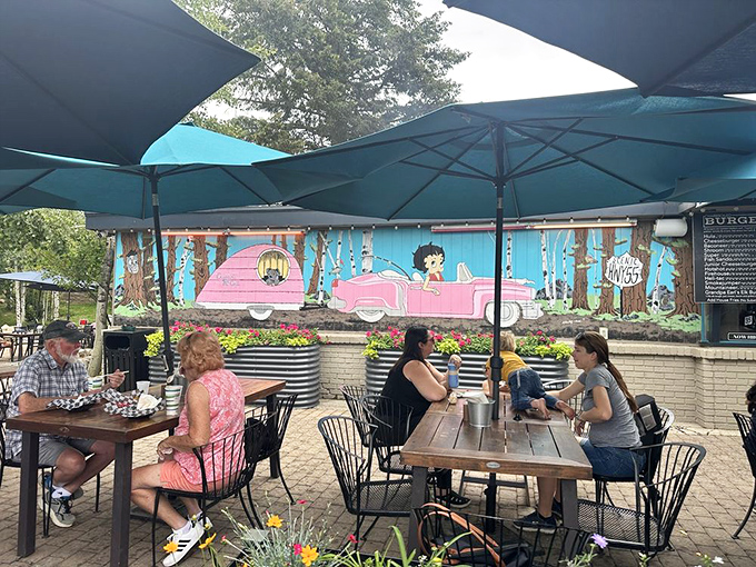 Outdoor dining with a side of whimsy. The colorful mural and mountain air make every bite taste better at My Father's Place patio.