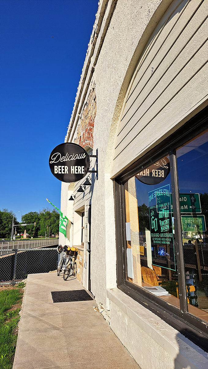 "Delicious Beer Here" isn't just a sign&mdash;it's a promise. Riverbank Brewing offers craft refreshment after a day of historical wandering.