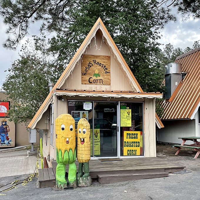 Fresh roasted corn with those cheerful mascots standing guard—because even vegetables deserve a proper welcome committee in Ruidoso.