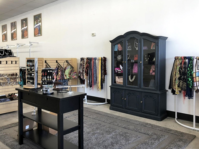 The jewelry display area—where statement pieces get their second act. Behind each necklace and scarf is someone thinking, "I can't believe someone gave this up!"