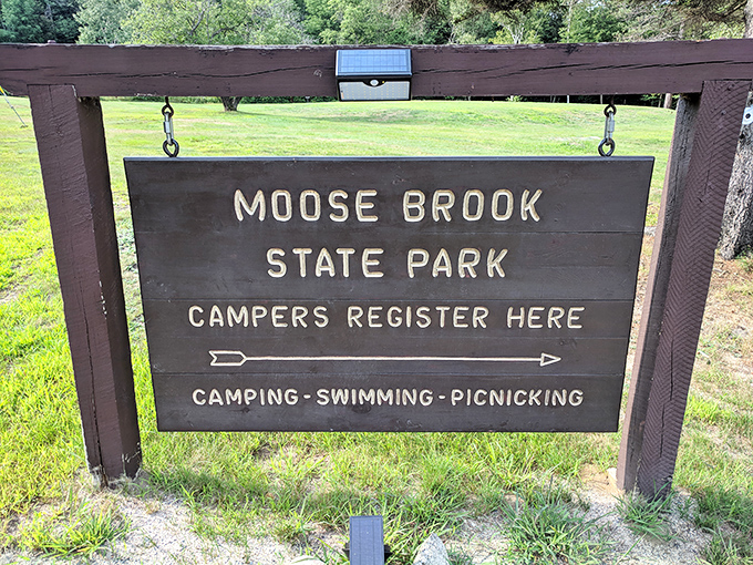 The sign says it all&mdash;camping, swimming, picnicking. The holy trinity of outdoor recreation awaits behind these wooden letters.