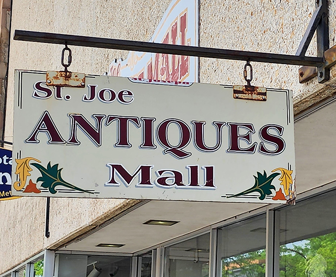The weathered sign swinging above the entrance &ndash; a beacon for treasure hunters and history lovers alike.