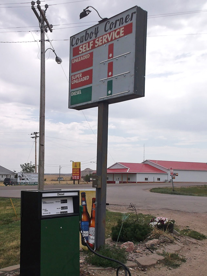 The sign promises fuel, but locals know Cowboy Corner feeds more than just your vehicle on long South Dakota drives.