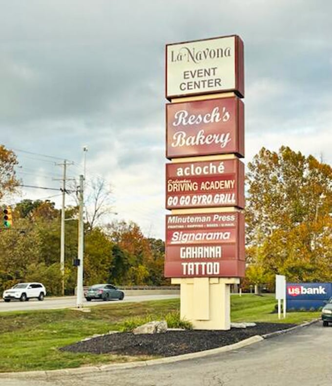The shopping center sign announces Resch's presence among everyday businesses &ndash; a sweet oasis in a desert of practical errands.