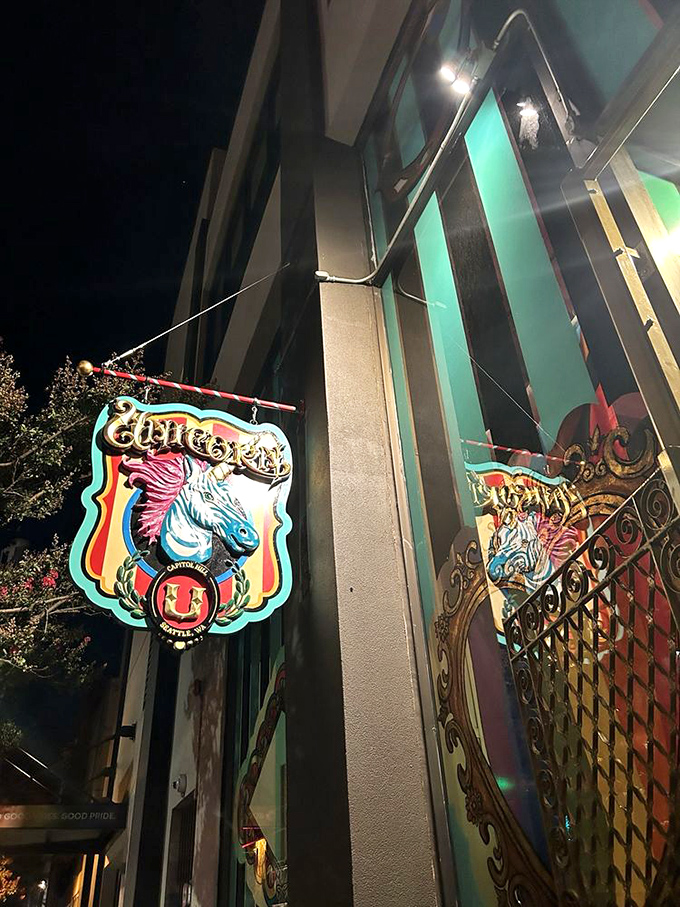 The Unicorn's exterior sign glows with mythical promise against the night sky, beckoning passersby into its technicolor wonderland.