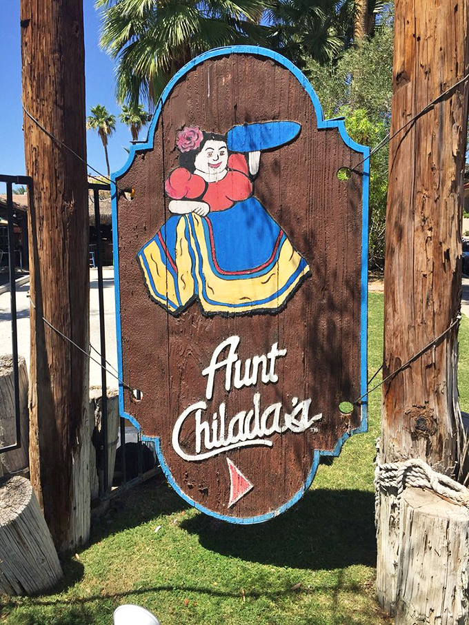 The wooden sign that launched a thousand cravings&mdash;Aunt Chilada's iconic logo promises authentic flavors and a warm welcome.