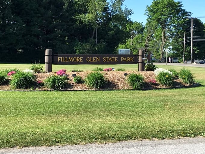 The welcoming sign, surrounded by carefully tended gardens, promises natural wonders that even the most jaded New Yorker can't resist.