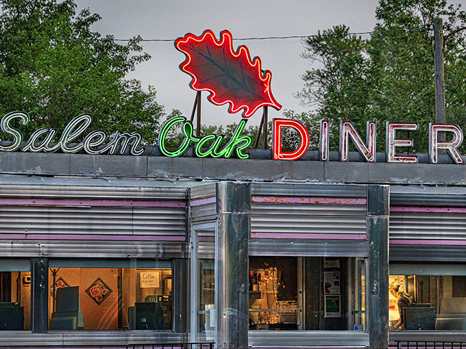 When the neon glows at dusk, Salem Oak Diner transforms from mere restaurant to beacon of hope for the hungry, the tired, and the breakfast-for-dinner crowd.
