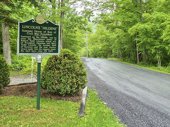 The road to history is sometimes literally a road—this unassuming entrance sign marks the beginning of a remarkable journey back in time.
