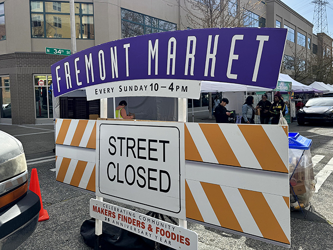 The purple banner announces the weekly transformation of ordinary streets into an extraordinary community gathering place.