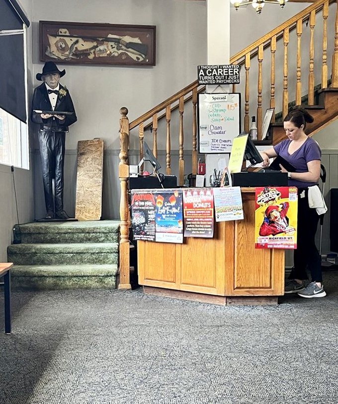 The host station, complete with quirky decor and a life-sized waiter statue, sets the tone for a dining experience that doesn't take itself too seriously.