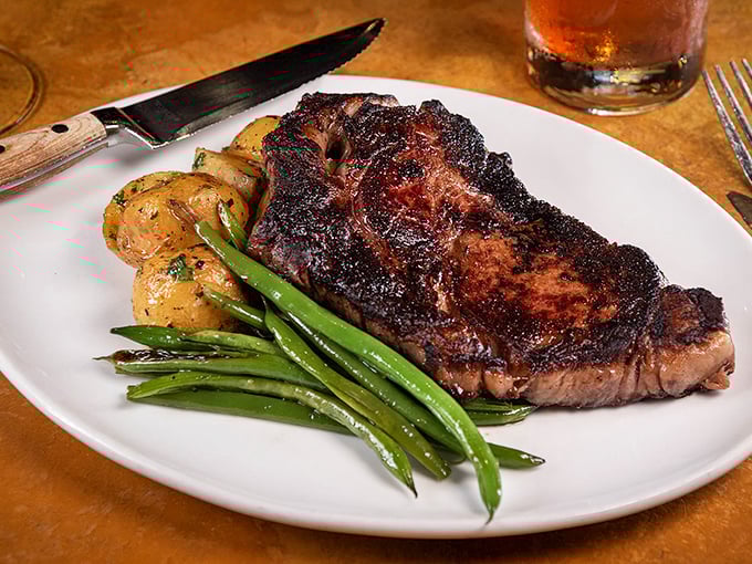 A perfectly seared steak with vibrant green beans&mdash;proof that Mancy's Italian prowess extends beyond pasta to the art of beef.