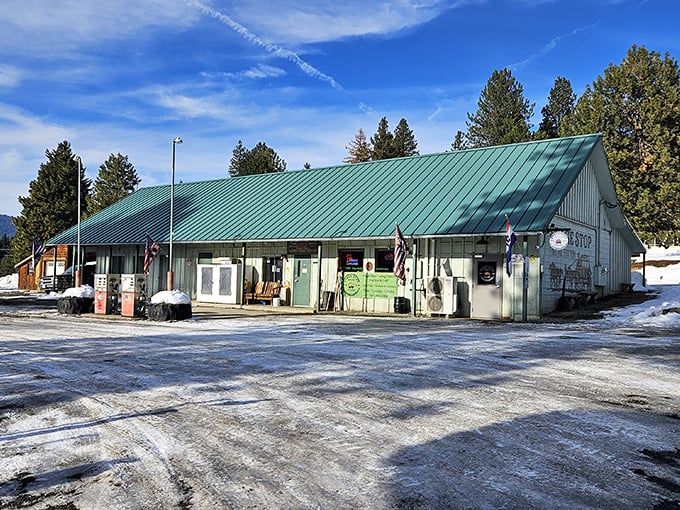 This unassuming fueling station doubles as a local watering hole, proving that in small mountain towns, the most essential services often share the same roof.