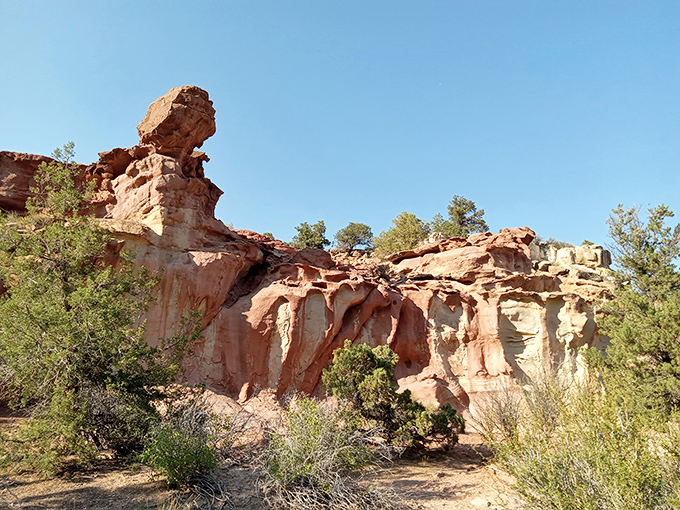 Sunset Peak's natural arch frames the blue sky beyond, a geological masterpiece that took millions of years longer than your home renovation.