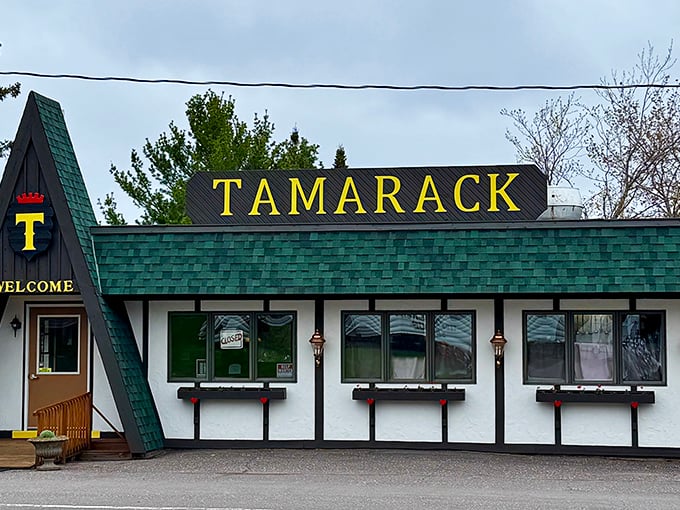 The Tamarack Inn's distinctive A-frame entrance signals comfort food and local stories await just beyond its doors.