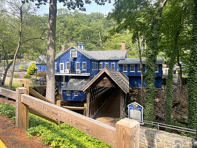 This isn't just a blue building by water&mdash;it's The Brushmill, where Connecticut's industrial past meets its picturesque present in spectacular fashion.