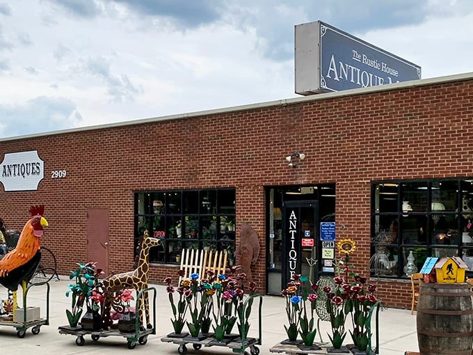 The Rustic House Antique Mall displays its personality right at the entrance. One person's discarded rooster sculpture is another's perfect porch guardian.