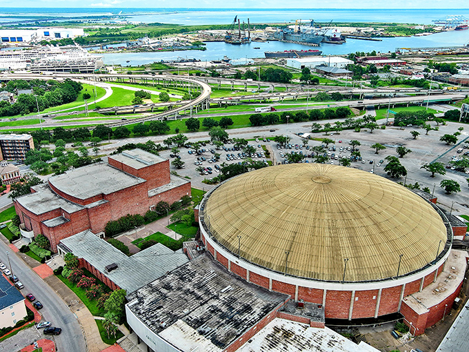 From above, Mobile's circular Civic Center dome resembles a giant hat tipped toward the bay, surrounded by the green ribbons of highways.