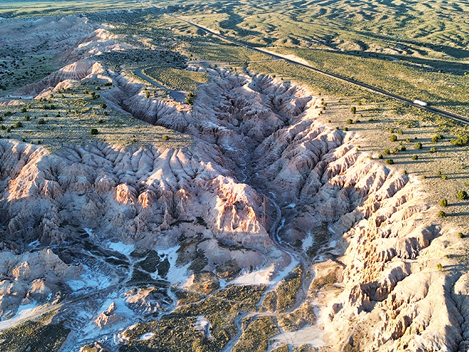 From above, the gorge resembles a lightning bolt frozen in time, a dramatic gash in the desert floor that reveals Earth's hidden layers.